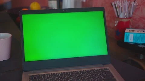 Laptop computer with green screen on tab... | Stock Video | Pond5