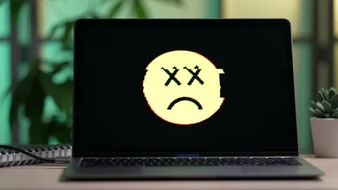 Laptop Computer Screen With a Sad Face E... | Stock Video | Pond5