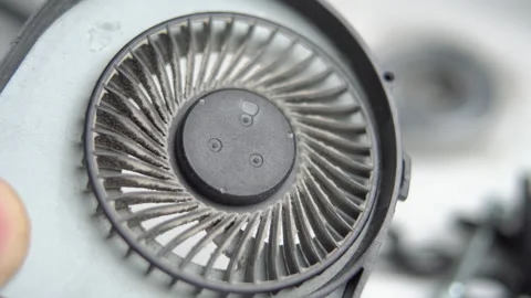 Laptop dirty CPU fan in hand. Dusty cool... | Stock Video | Pond5