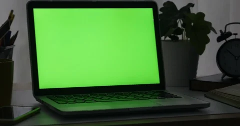 Laptop with green screen. Dark office. D... | Stock Video | Pond5