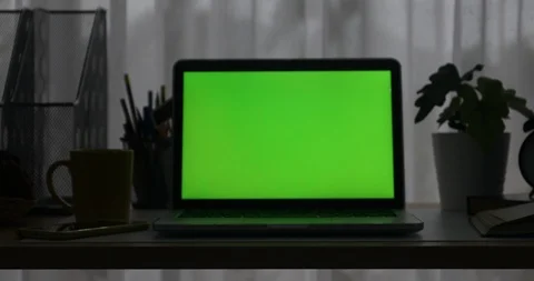 Laptop with green screen. Dark office. D... | Stock Video | Pond5