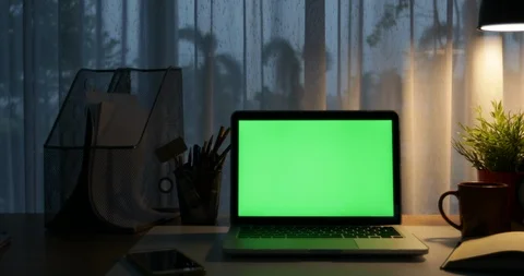 Laptop with green screen. Dark office. D... | Stock Video | Pond5