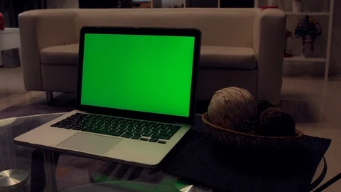 Laptop with green screen. Dark office. | Stock Video | Pond5