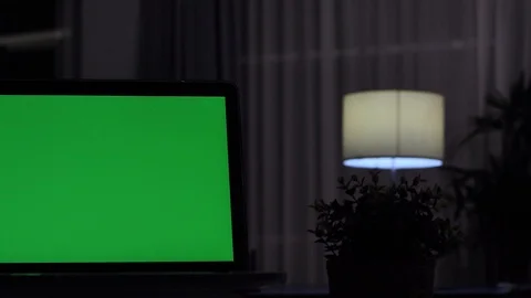 Laptop with green screen. Dark office. | Stock Video | Pond5
