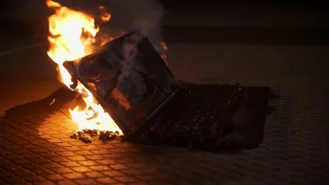 Laptop keyboard on fire and melting | Stock Video | Pond5