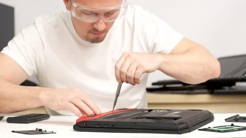 Laptop repair, computer service. Man rep... | Stock Video | Pond5