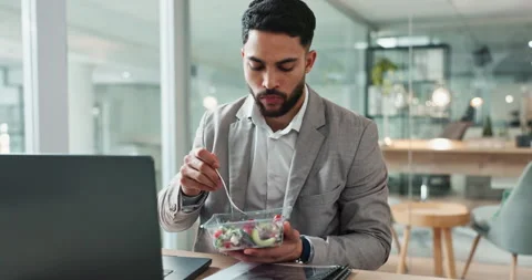 Laptop, salad and a business man eating ... | Stock Video | Pond5