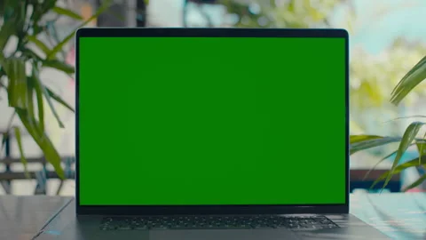 Laptop on table with Chroma green screen... | Stock Video | Pond5