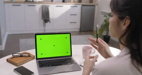 Laptop on table with green screen, chrom... | Stock Video | Pond5