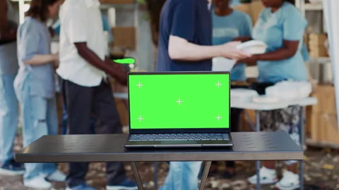 Laptop on table with green screen | Stock Video | Pond5