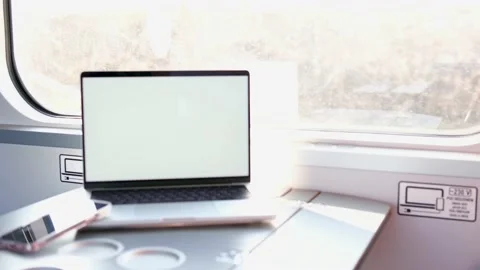laptop with white screen in the train mo... | Stock Video | Pond5