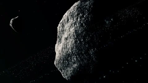 Large asteroid rotating with small cosmi... | Stock Video | Pond5