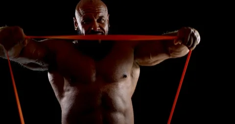 a large bald man with a beard and bronze... | Stock Video | Pond5