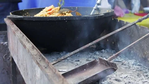 A large bowl with Uzbek pilaf is standin... | Stock Video | Pond5