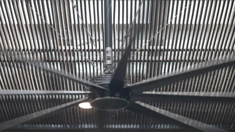 Large ceiling fan spins above a wide ope... | Stock Video | Pond5