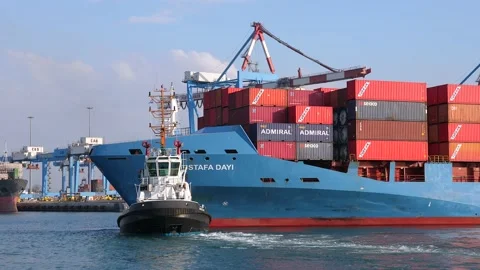 Large Container Ship escorted away from ... | Stock Video | Pond5