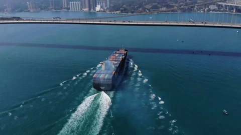 Large container ship move to huge bridge... | Stock Video | Pond5