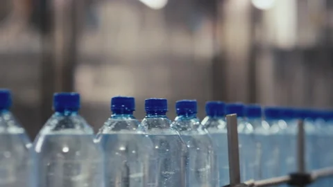 Large Conveyor Mechanism Moving Bottles ... | Stock Video | Pond5