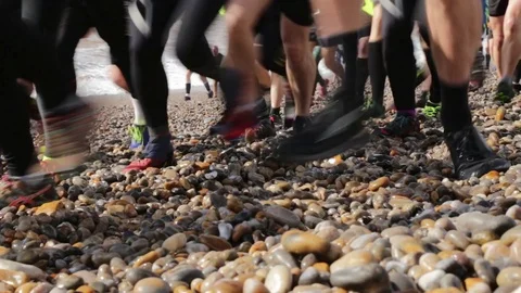Large group of people running on the peb... | Stock Video | Pond5