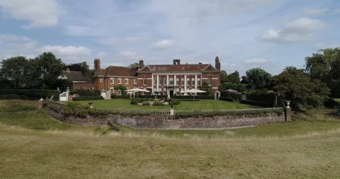 Large manor house with stone wall in the... | Stock Video | Pond5