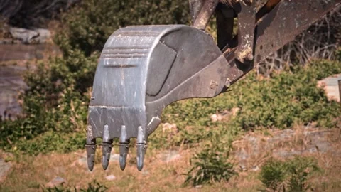 Large metal scoop of a digger with teeth... | Stock Video | Pond5