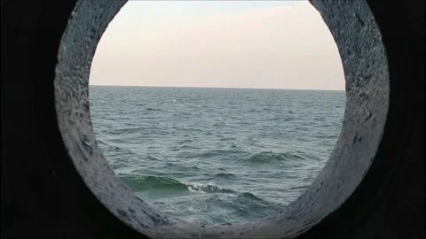 Large ocean waves are visible from the s... | Stock Video | Pond5