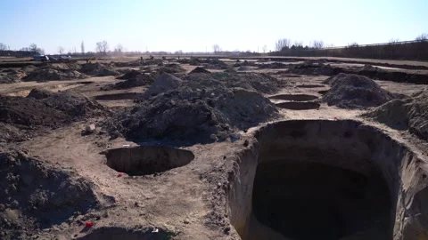 Large opening to pit at archaeology site... | Stock Video | Pond5