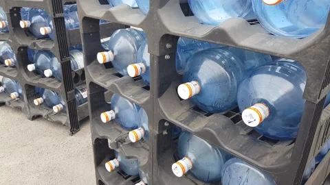Large plastic bottles for drinking water... | Stock Video | Pond5