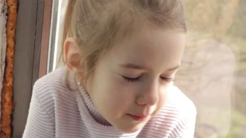 a large portrait of a little crying girl... | Stock Video | Pond5