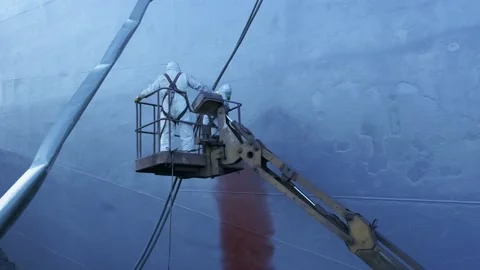 Large ship being painted by a dock worke... | Stock Video | Pond5