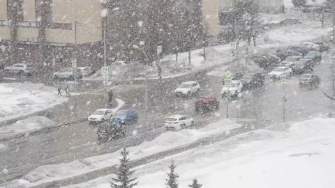 Large snow on the background of a busy i... | Stock Video | Pond5