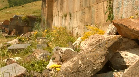 Large Stone Wall with Rubble and Overgro... | Stock Video | Pond5