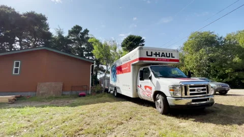 Large U-Haul truck parked by a house. Mo... | Stock Video | Pond5