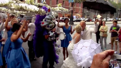 Large wedding parade walking down the st... | Stock Video | Pond5