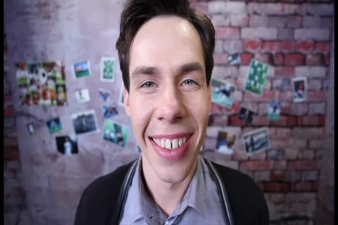 Laughing and smiling man on brick wall b... | Stock Video | Pond5