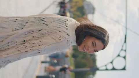 Laughing lady turning camera walking bri... | Stock Video | Pond5