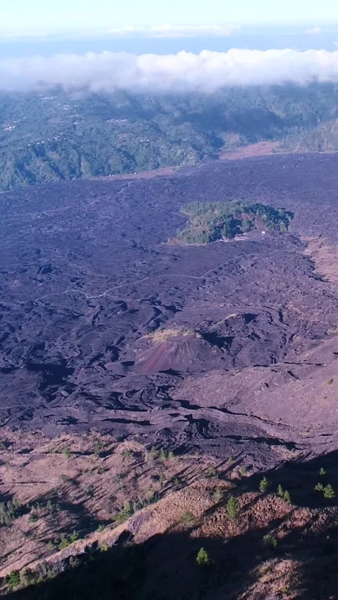 Lava field at the bottom of volcano crat... | Stock Video | Pond5