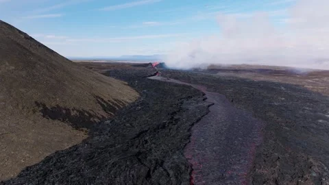 Lava river flowing from volcano eruption... | Stock Video | Pond5