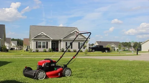 Lawn mower, filling with gas and mowing ... | Stock Video | Pond5