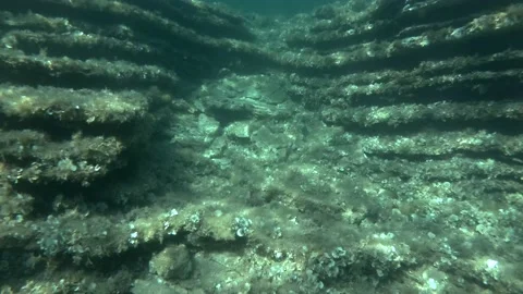 Layered rocky bottom of sedimentary rock... | Stock Video | Pond5