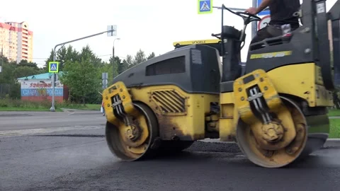 Laying and compaction a new asphalt pave... | Stock Video | Pond5