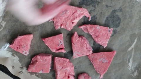 Laying the pieces of beef lung on a baki... | Stock Video | Pond5