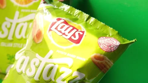 lays potato chips packet on green backgr... | Stock Video | Pond5