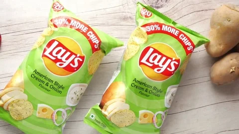 lays potato chips packet table | Stock Video | Pond5