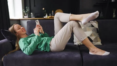 Lazy happy customer woman browsing socia... | Stock Video | Pond5