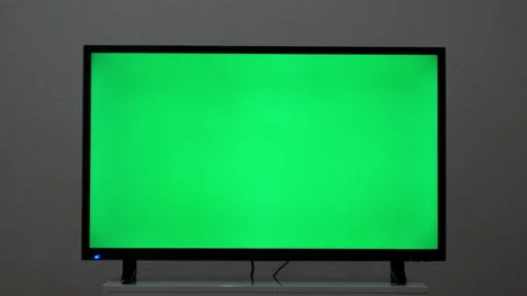 LcD smart TV with green screen on a grey... | Stock Video | Pond5