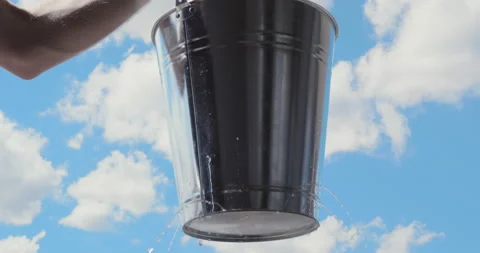 Leaky bucket with water dripping against... | Stock Video | Pond5