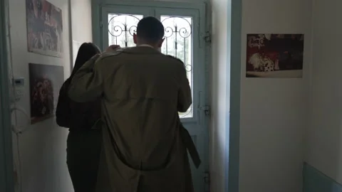 Leaving home: Couple getting ready to go... | Stock Video | Pond5