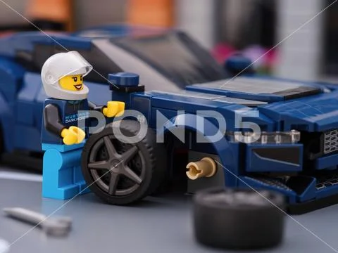 Photograph: Lego driver changing wheel of Lego Ford Mustang Dark Horse ...