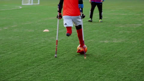 Legs of disabled football plaer with bal... | Stock Video | Pond5